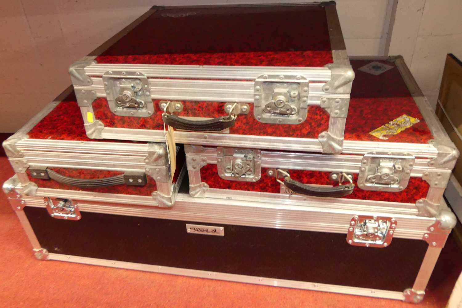 Assorted brushed aluminium bound musical instrument trunks, to include ...