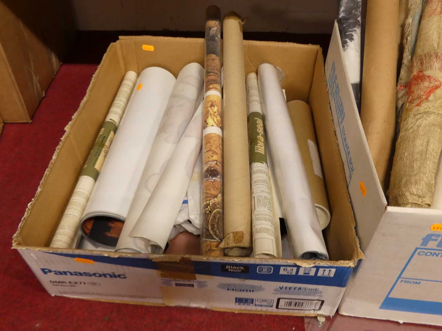 Two boxes containing a quantity of mixed posters, wall hangings, etc