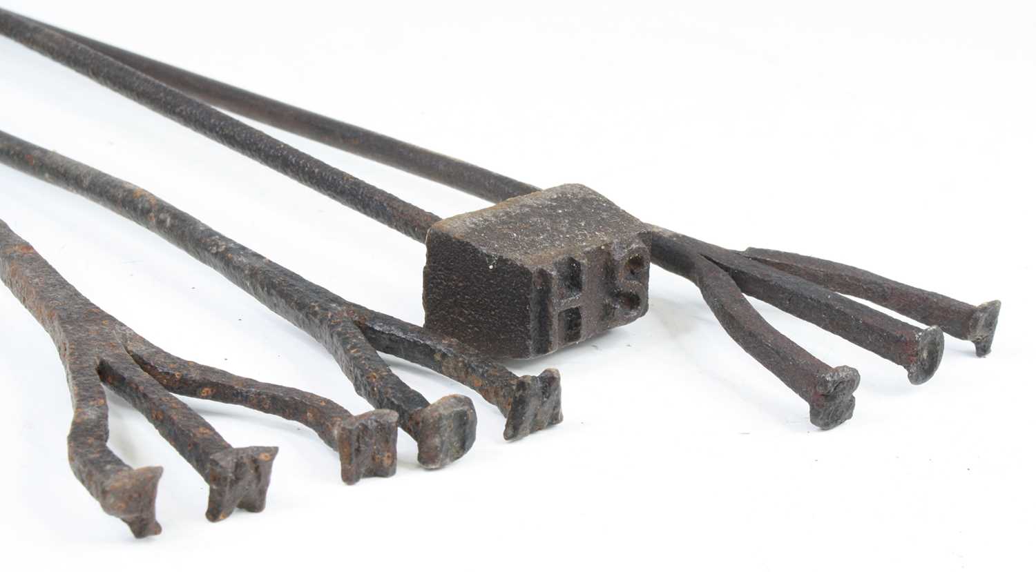 A 19th century iron trap, having 7" rounded serrated jaws, together ...