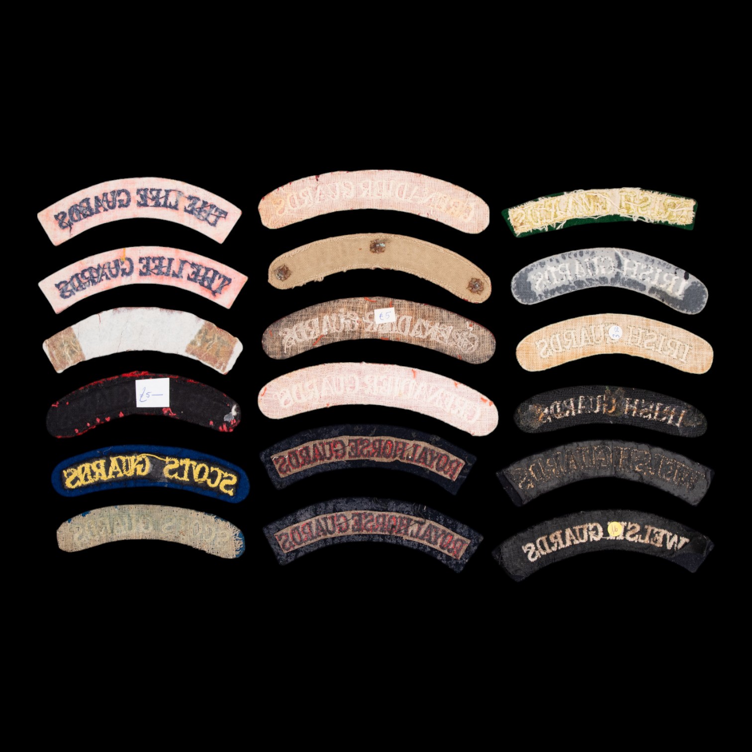 A group of various British Army Guards shoulder titles
