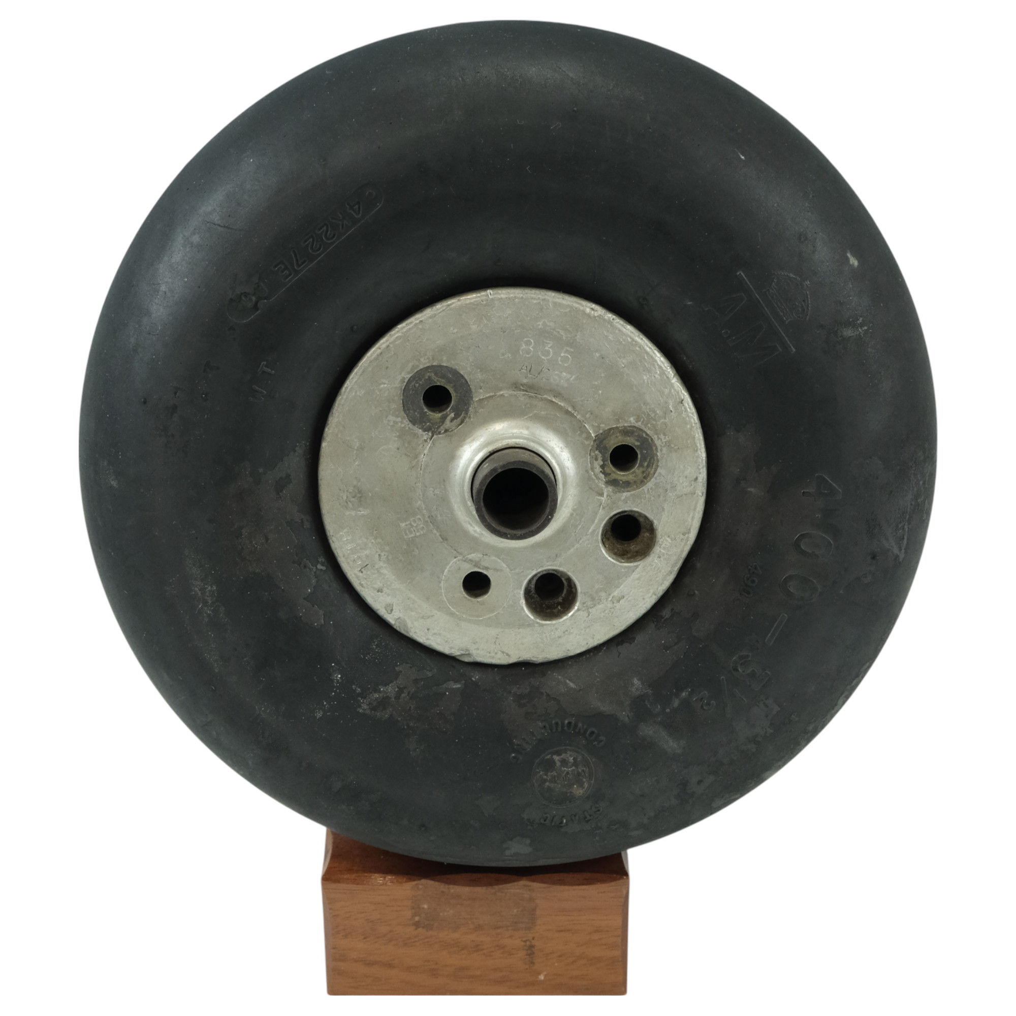 A Second World War RAF Hurricane or similar aircraft tail wheel, on a ...