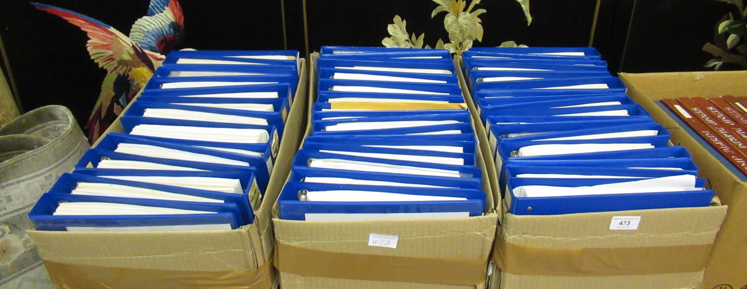 Three boxes containing large quantity of World stamps in blue albums