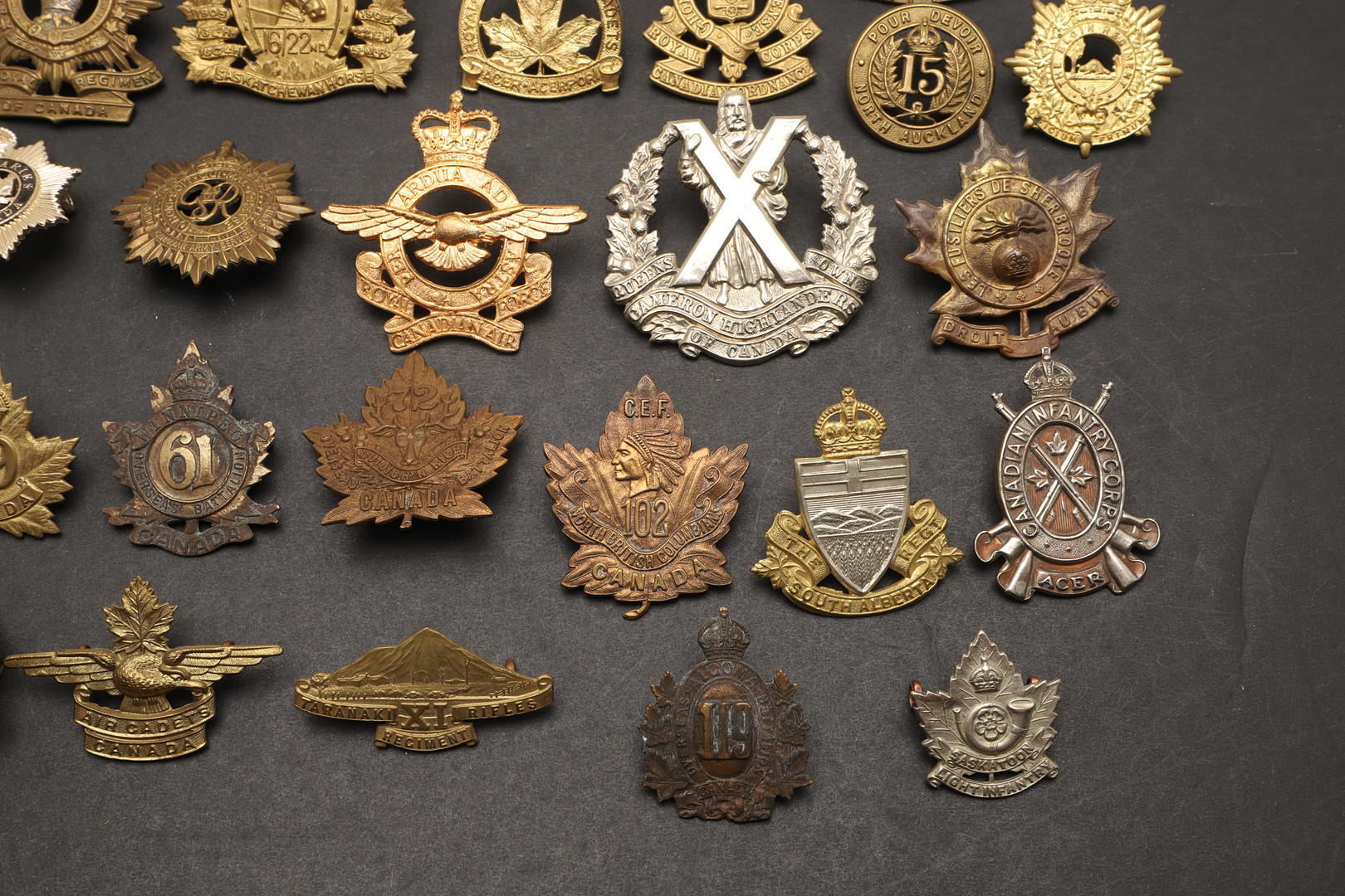 A COLLECTION OF FORTY FIVE CANADIAN MILITARY CAP BADGES TO INCLUDE ...