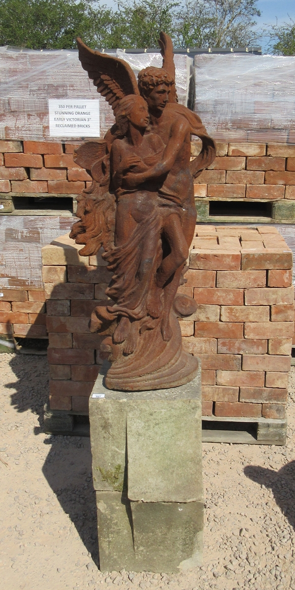 Large cast-iron statue of Cupid and Psyche on natural stone plinth ...