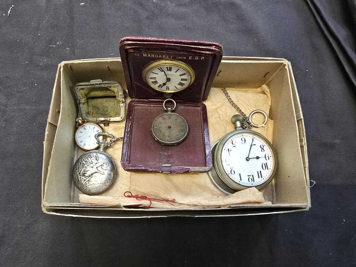 A box containing four pocket watches, and one small cased time piece