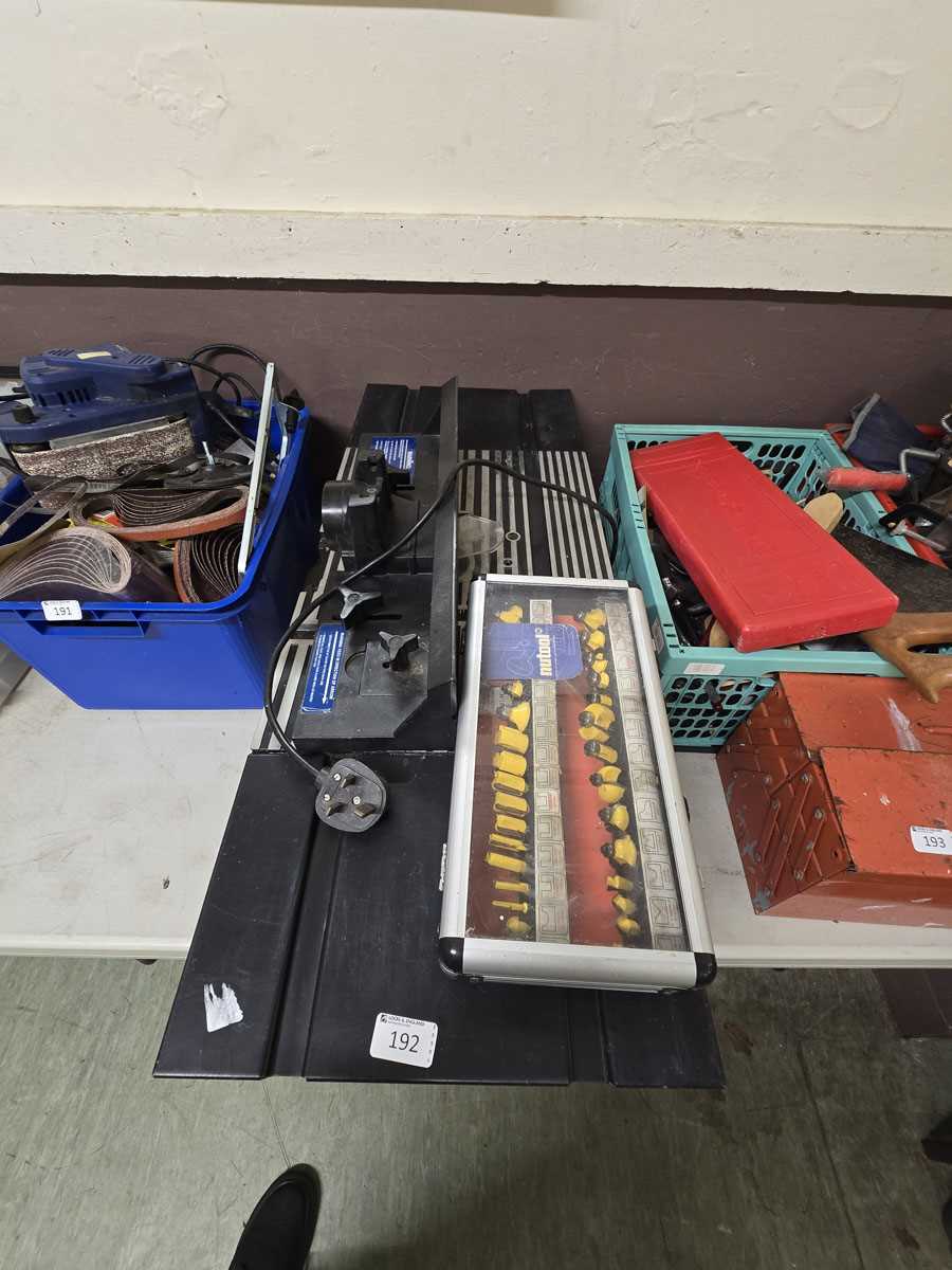 A Nutool 240V router table with router bits