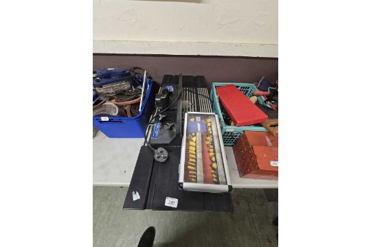 A Nutool 240V router table with router bits