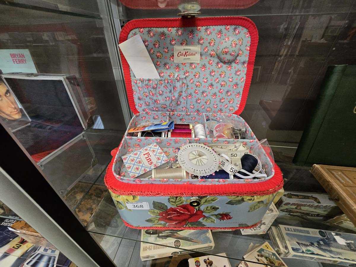 A Cath Kidston modern jewellery box containing an assortment of sewing ...