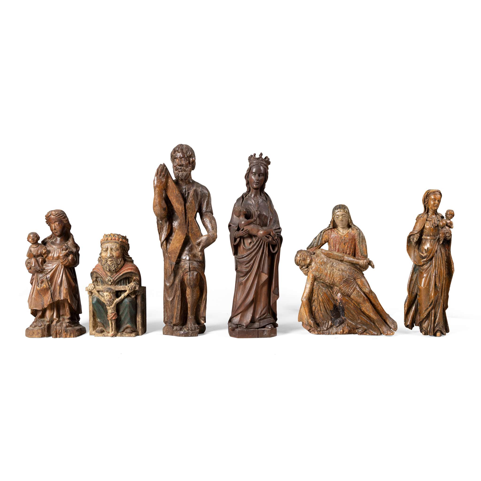 A GROUP OF SIX CARVED WOODEN FIGURES 16TH - 19TH CENTURY Comprising a ...