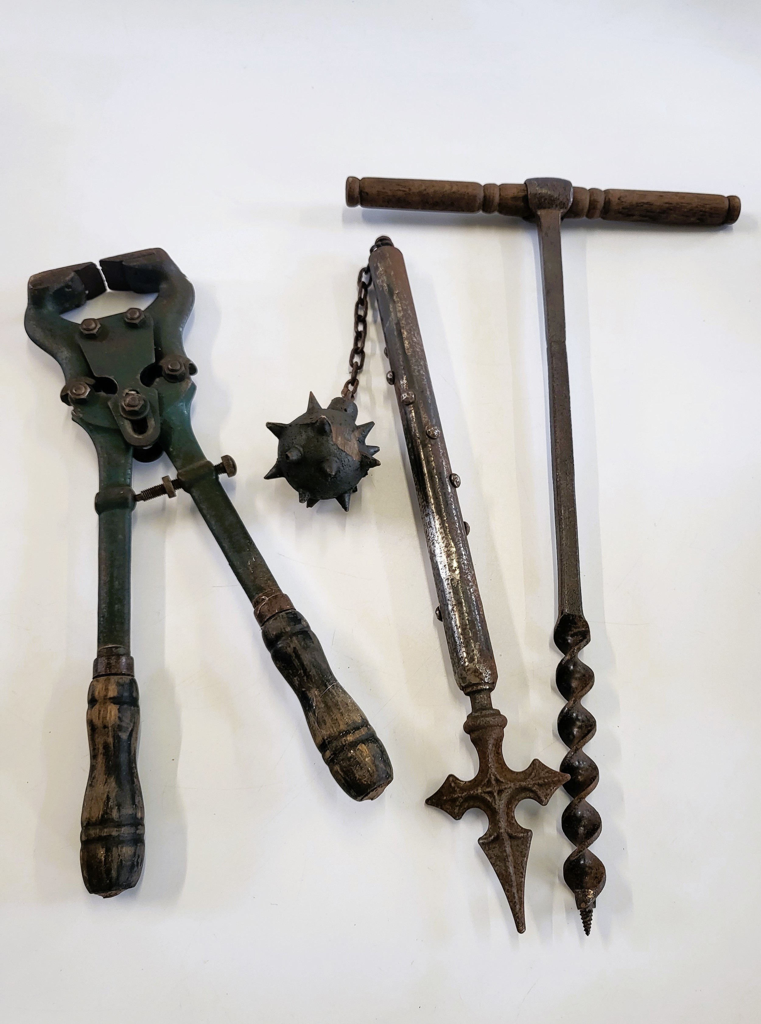A medieval mace, a lever action chain/ bolt cutter and a wooden hand ...