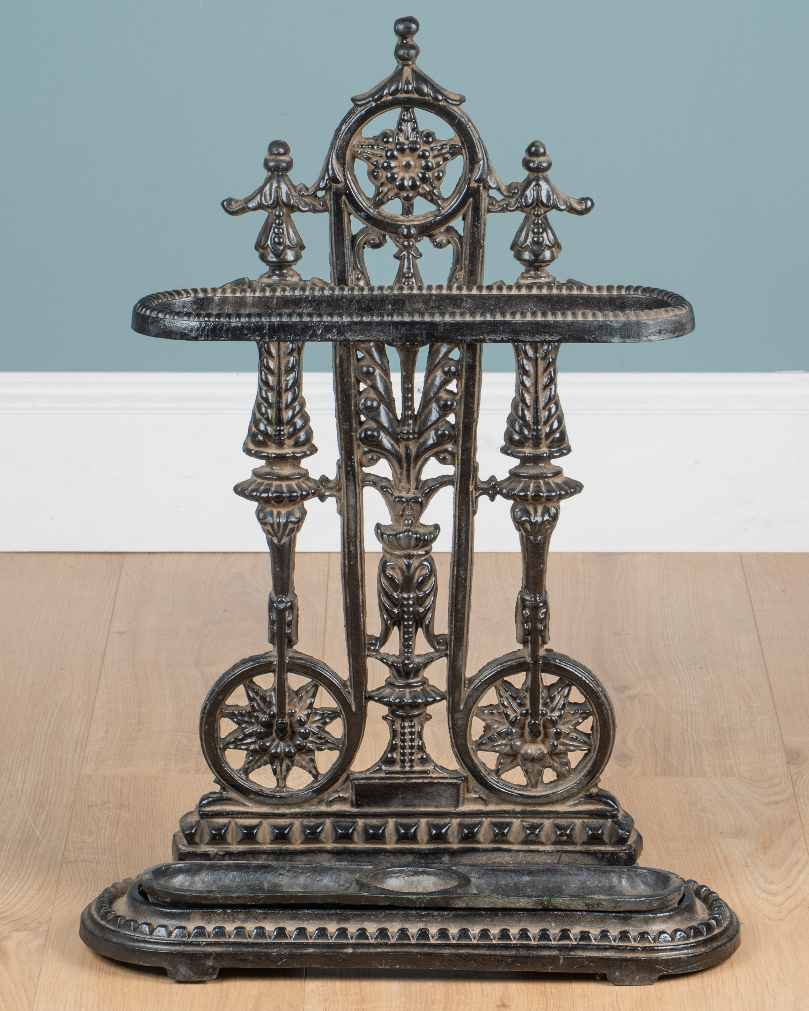 A Victorian cast iron stick stand With pierced foliate decoration to ...