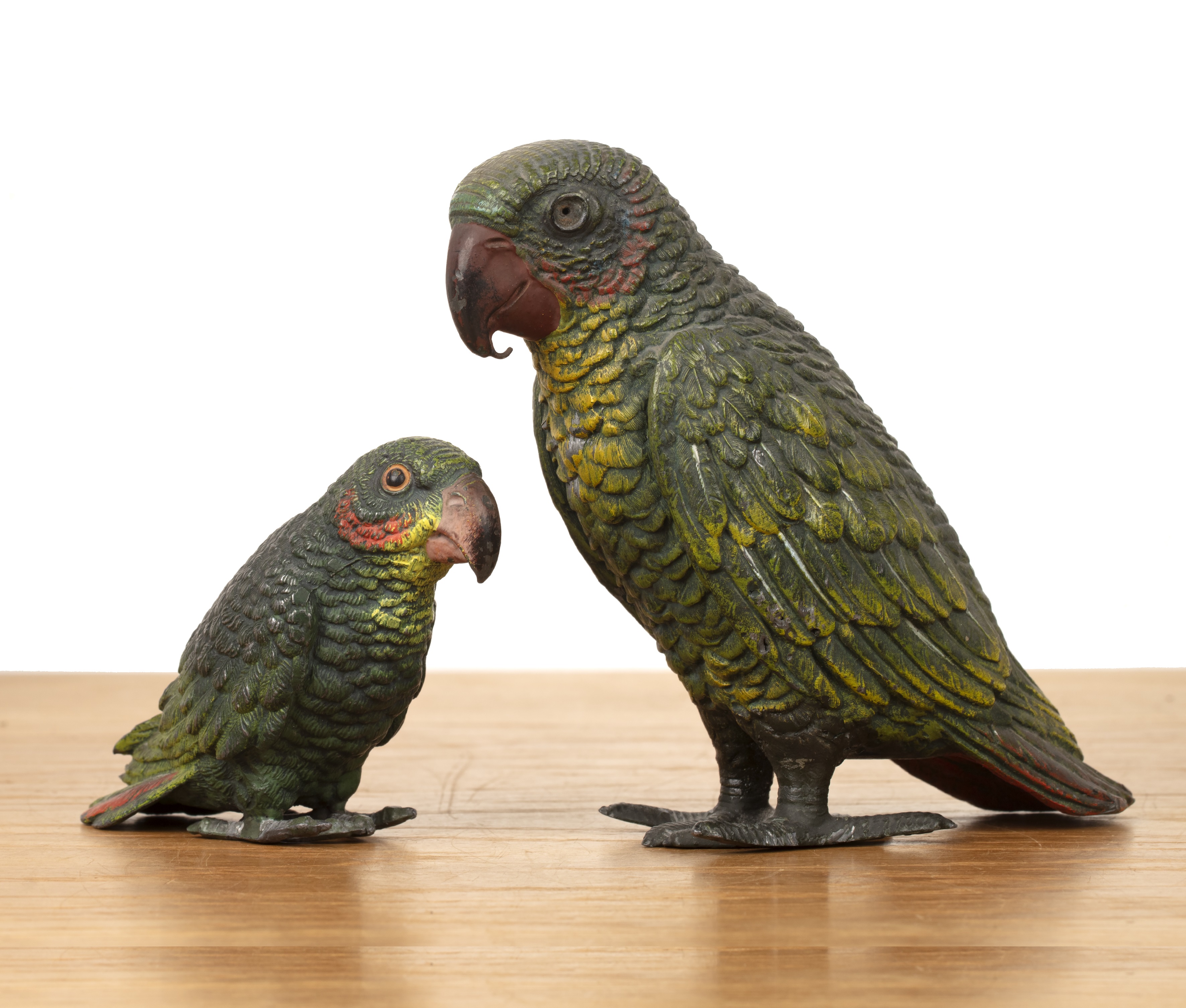 Two tin model parrotsearly 20th Century, handpainted; the larger with ...