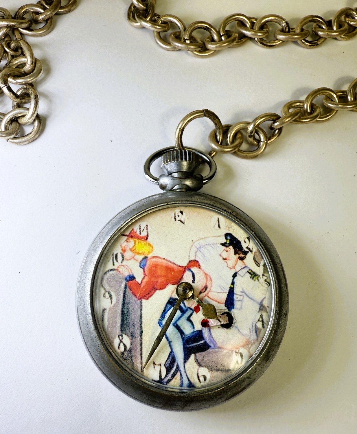 A Novelty pocket watch with 'erotic' scene to dial on white metal ...