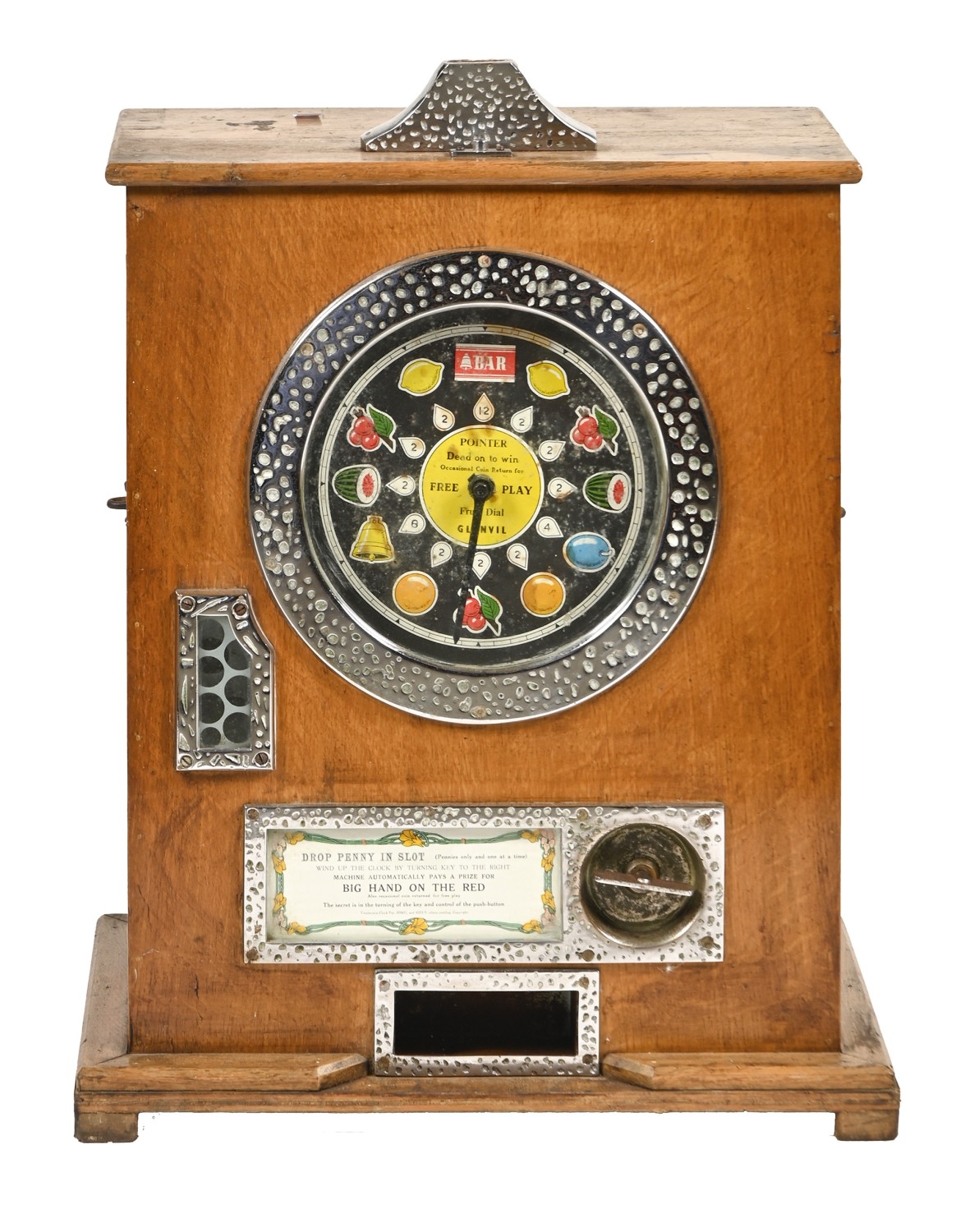 Mechanical gaming. An oak cased slot machine, c1950s, fruit dial ...