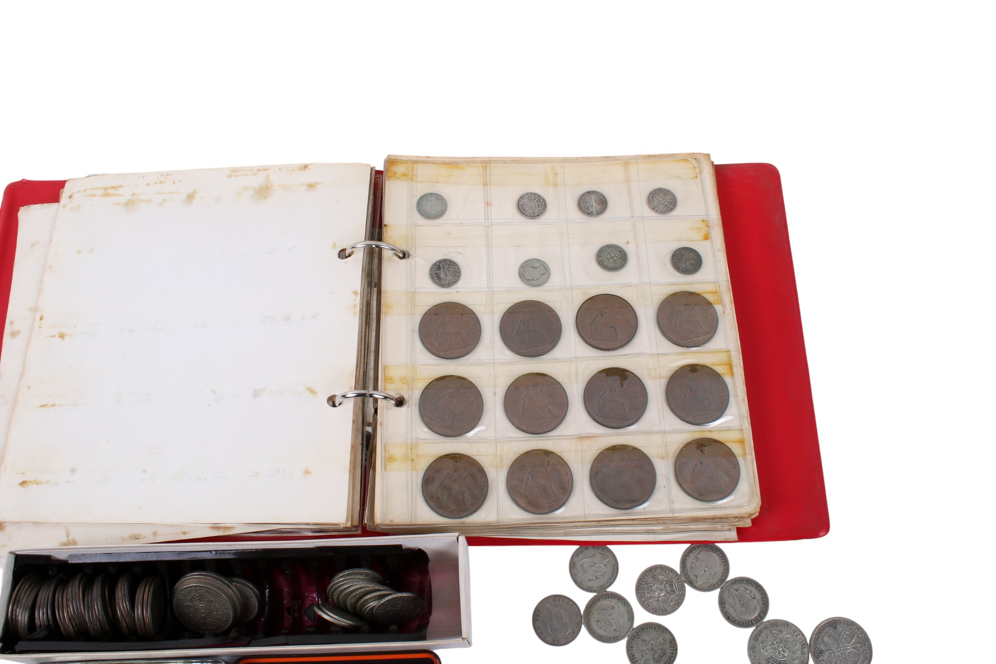 An album of pre-decimal coins. With a good quantity of pre-1947 silver ...