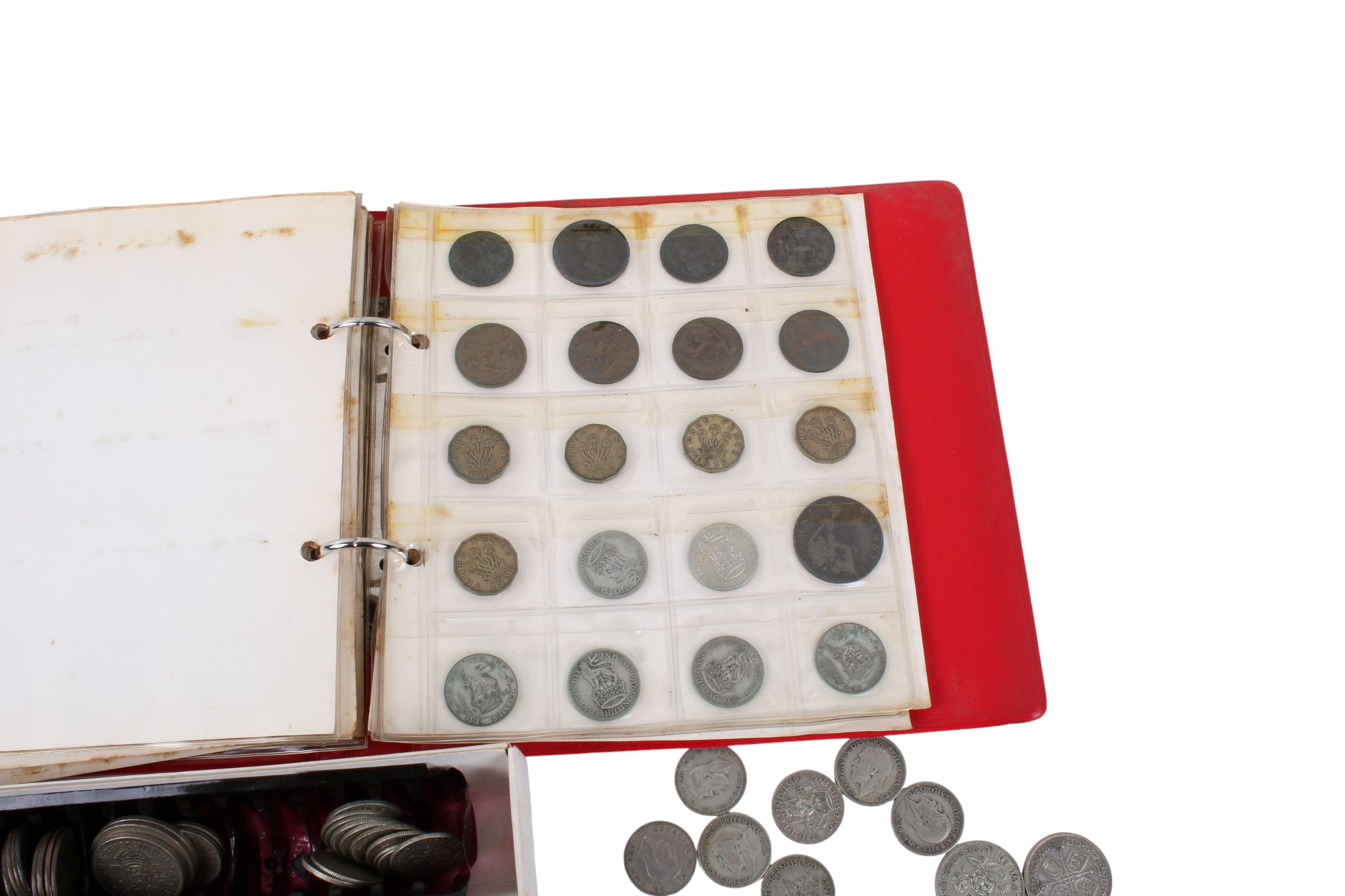An album of pre-decimal coins. With a good quantity of pre-1947 silver ...