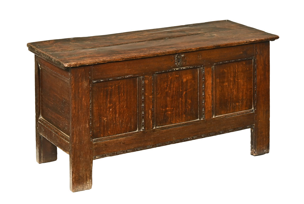 An antique oak coffer, of small size with two plank top and three ...