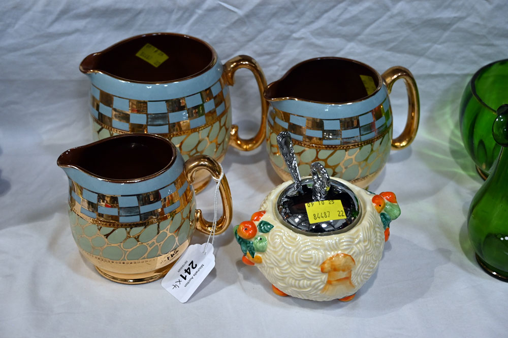Clarice Cliff Celtic Harvest jam pot and three Sadlers lustre ware jugs