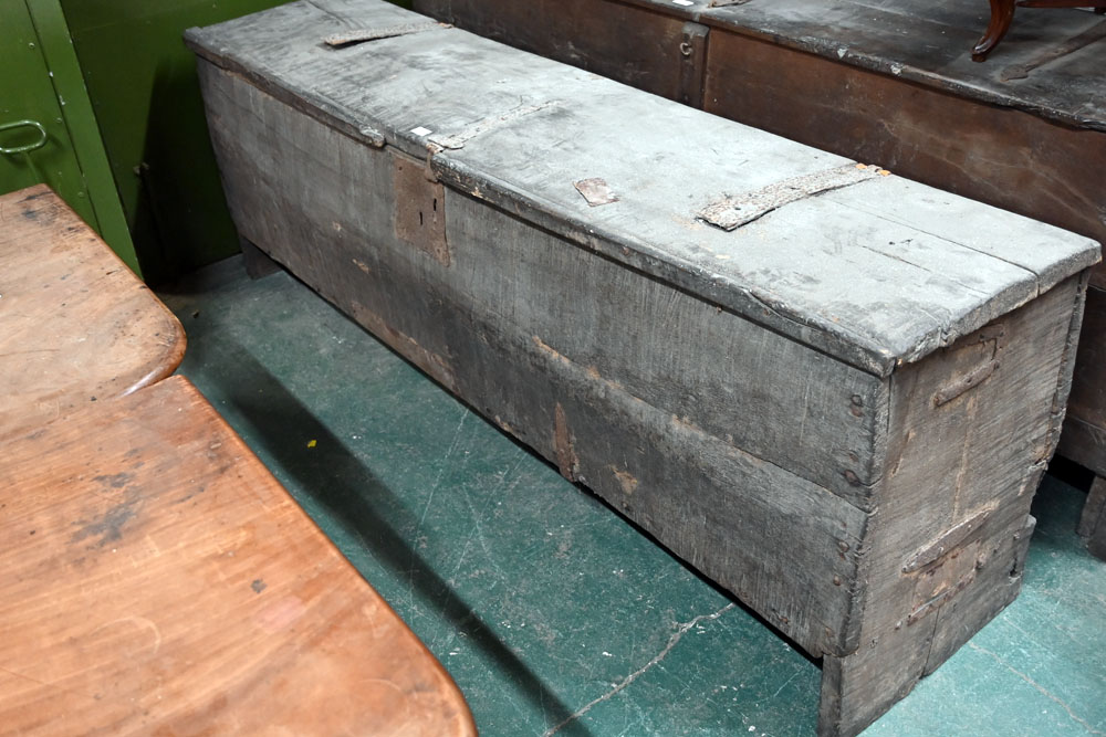A large 17th century primitive oak six plank coffer, with heavy top and ...