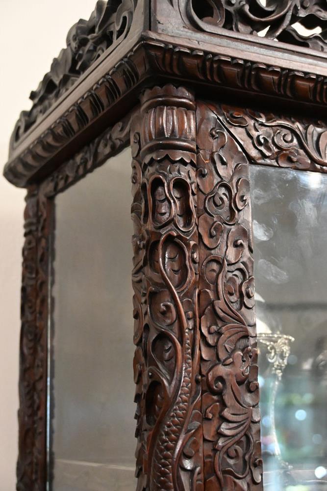 A late 19th century Chinese hardwood display cabinet, with dragon ...