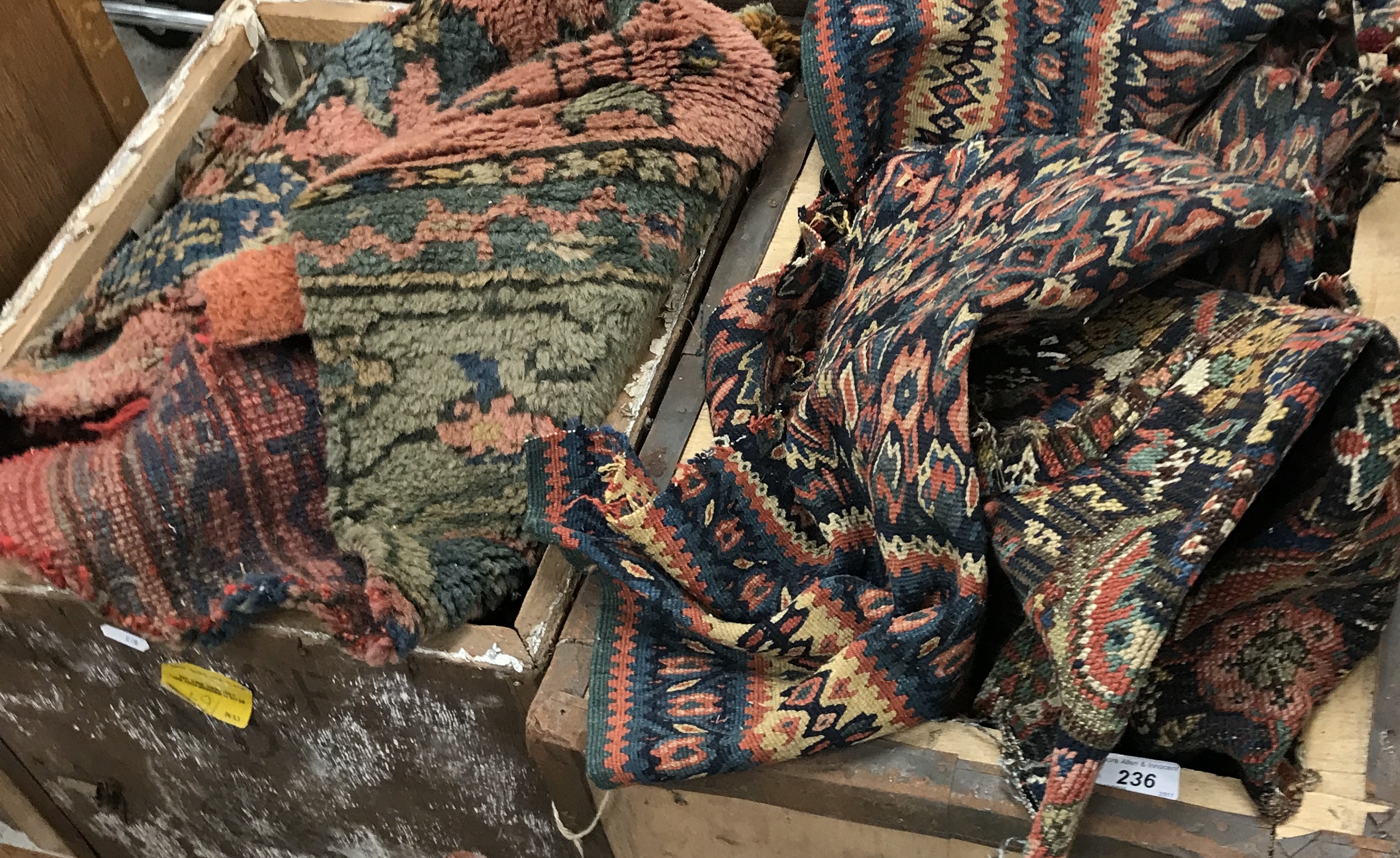 Three tea chests containing a large quantity of various carpet and rug ...