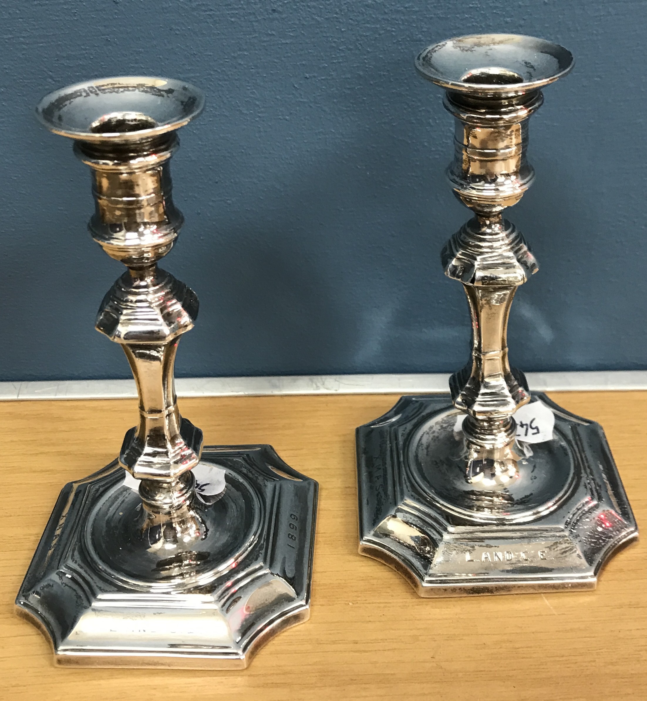 A pair of Victorian silver taper sticks in the Georgian style ...