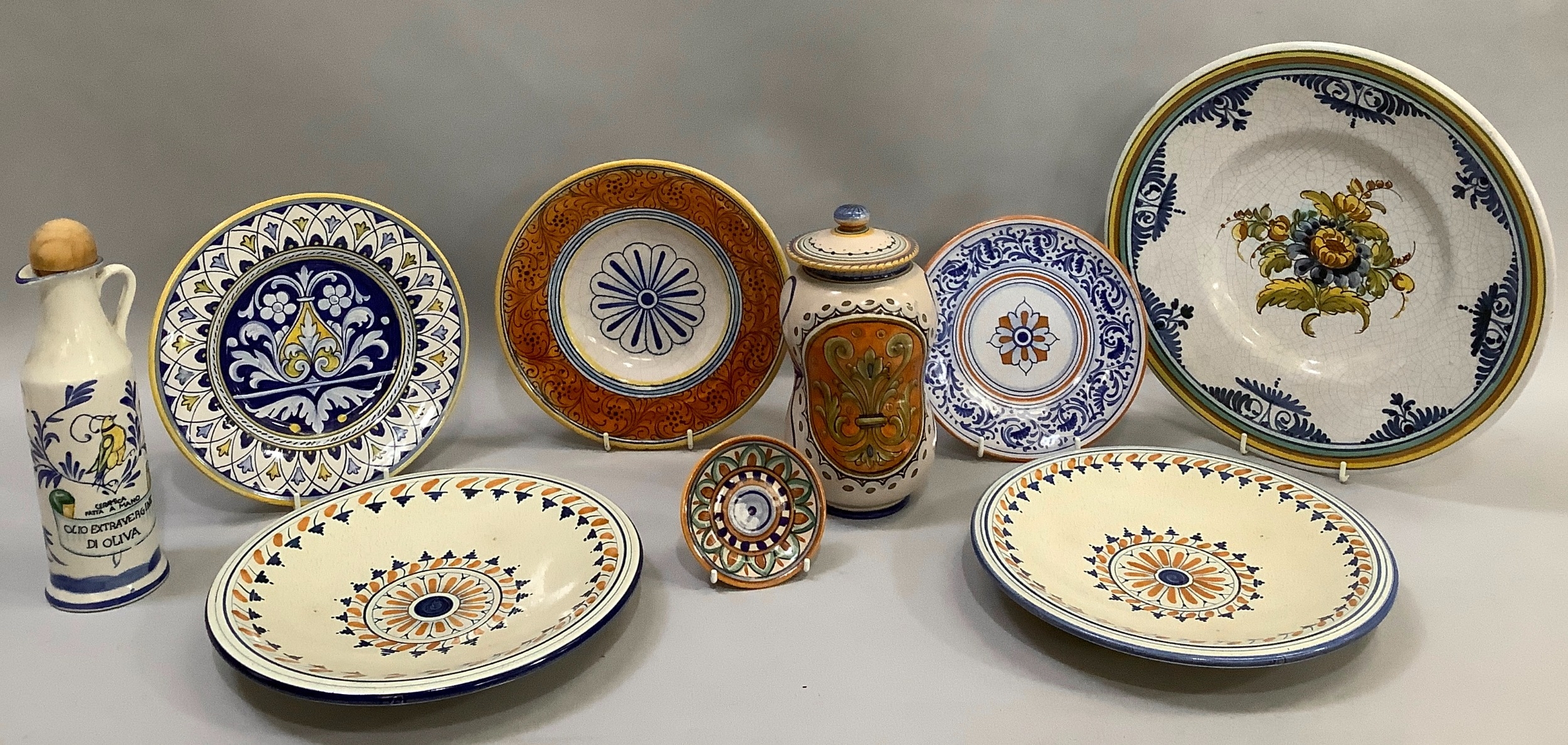 A collection of Italian tin glaze type ceramics including a charger ...