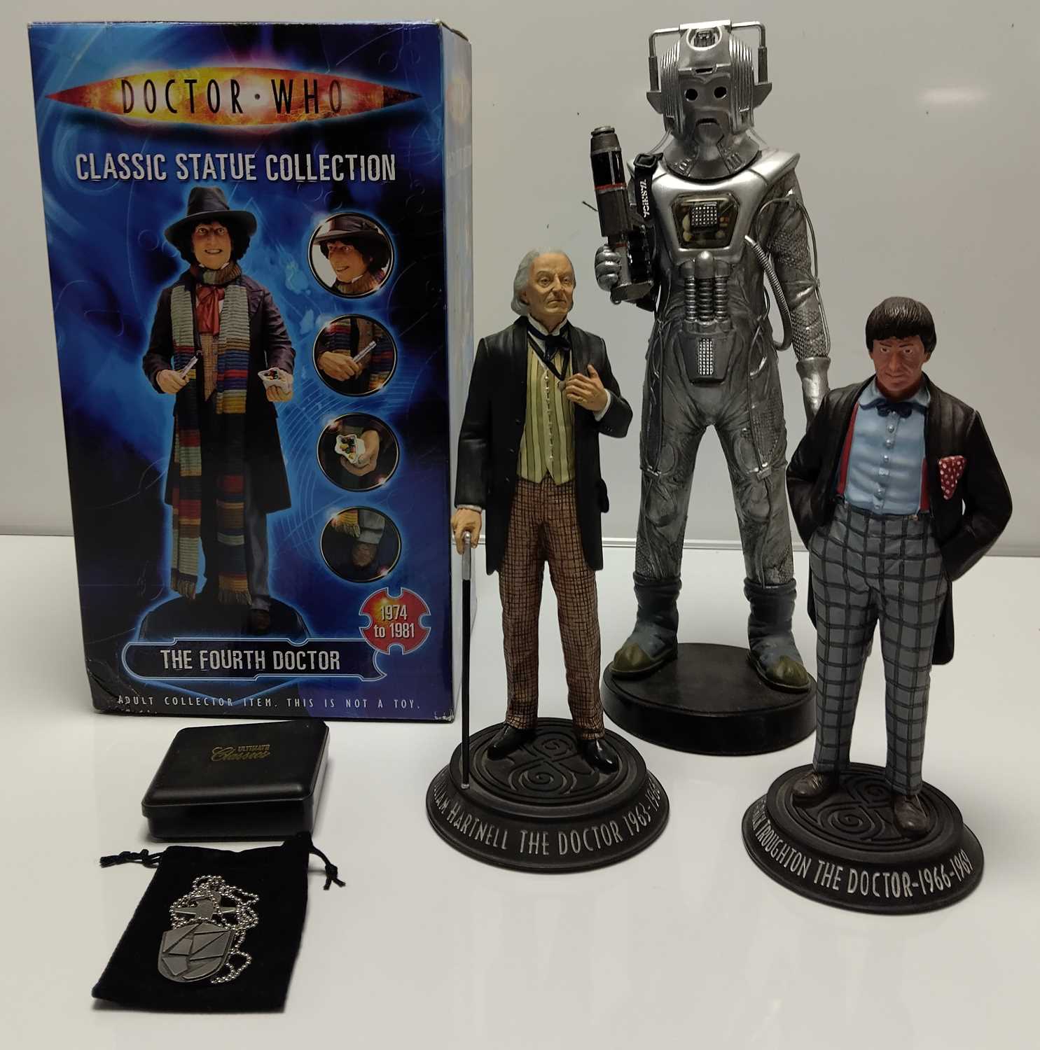Collection of 4 Doctor Who figurines and a TARDIS key. Contains: The ...