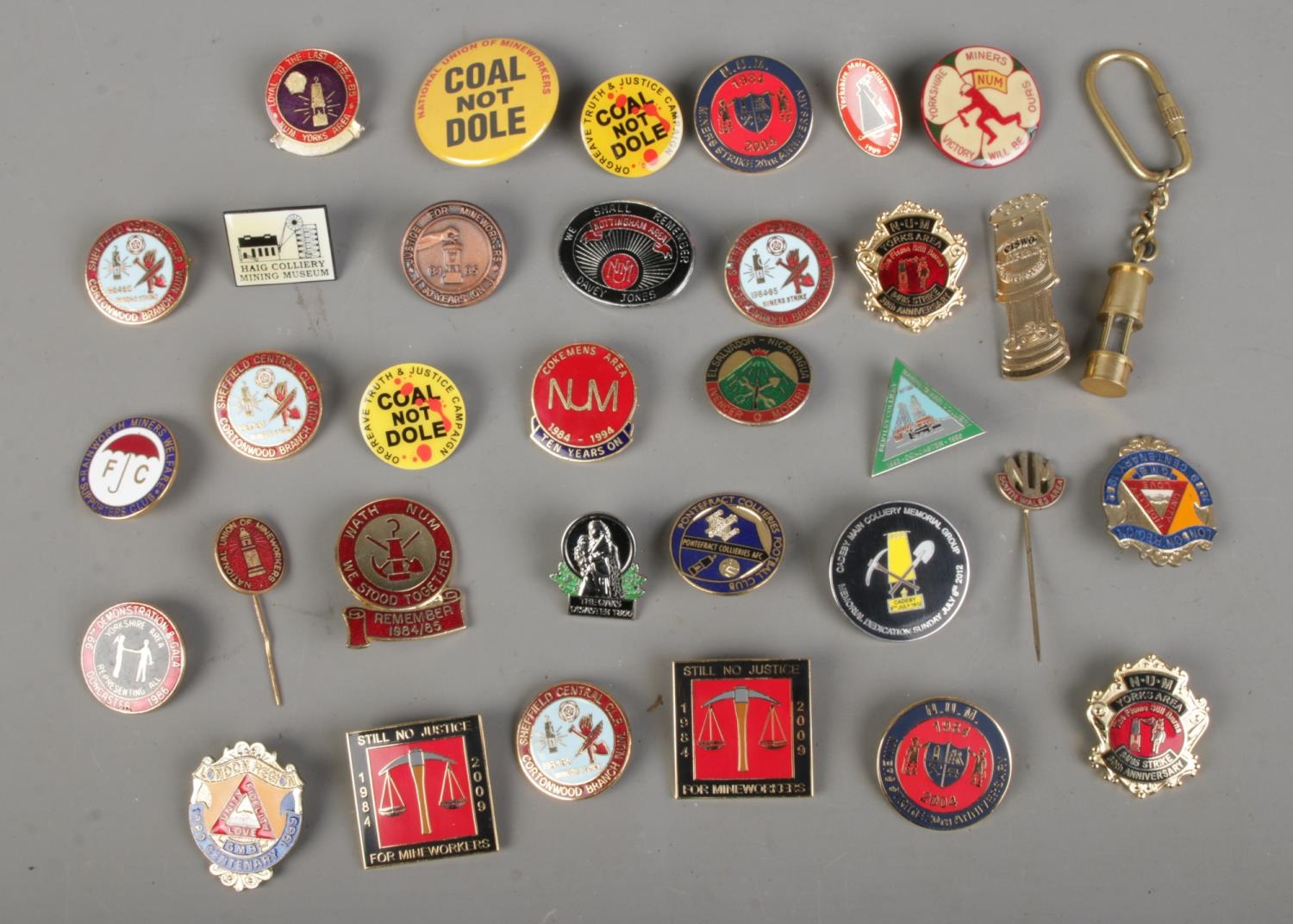 A good collection of mining and colliery pin badges and stick pins to ...