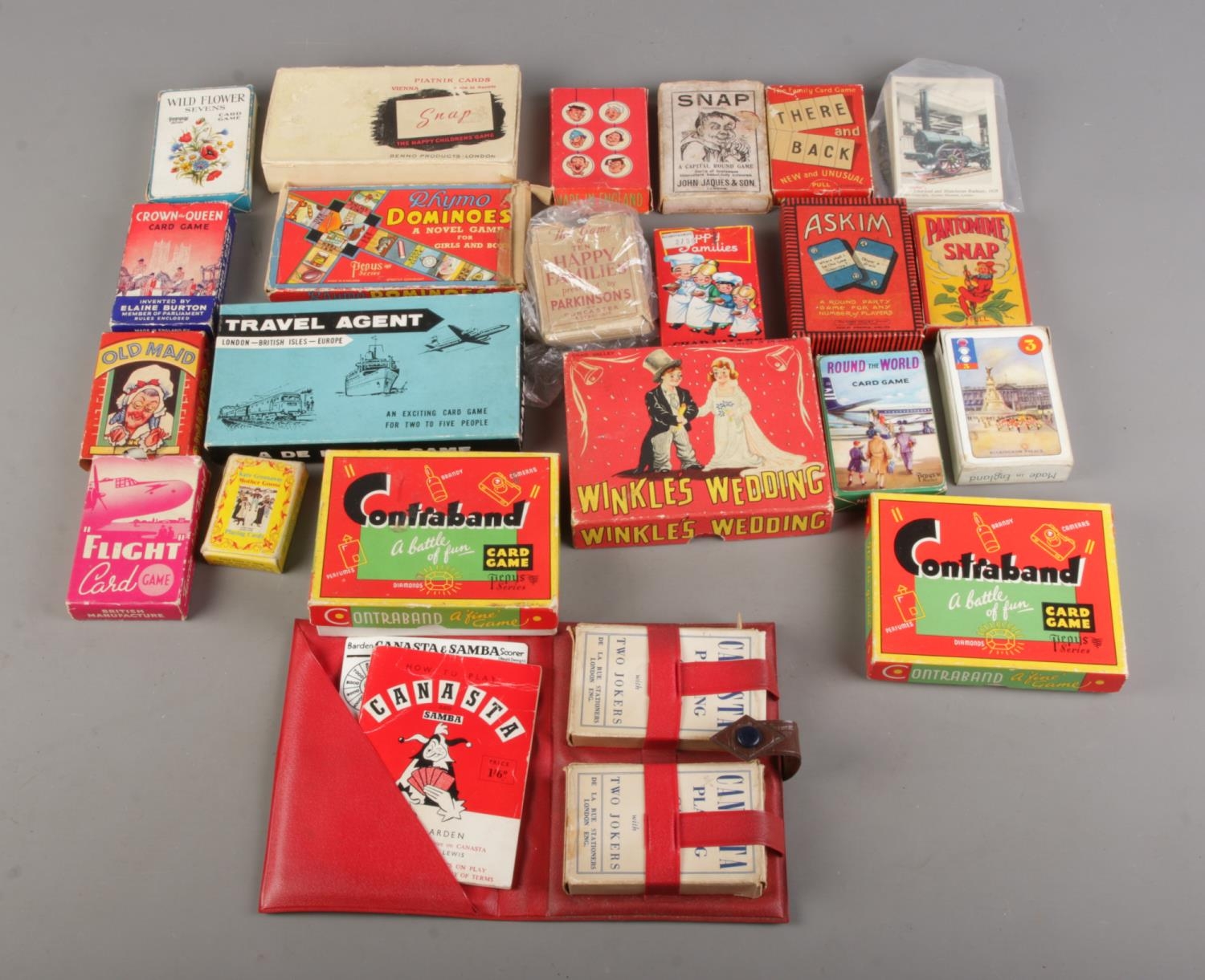 A box of assorted vintage card games to include Contraband, Flight Card Game, There and Back, Win