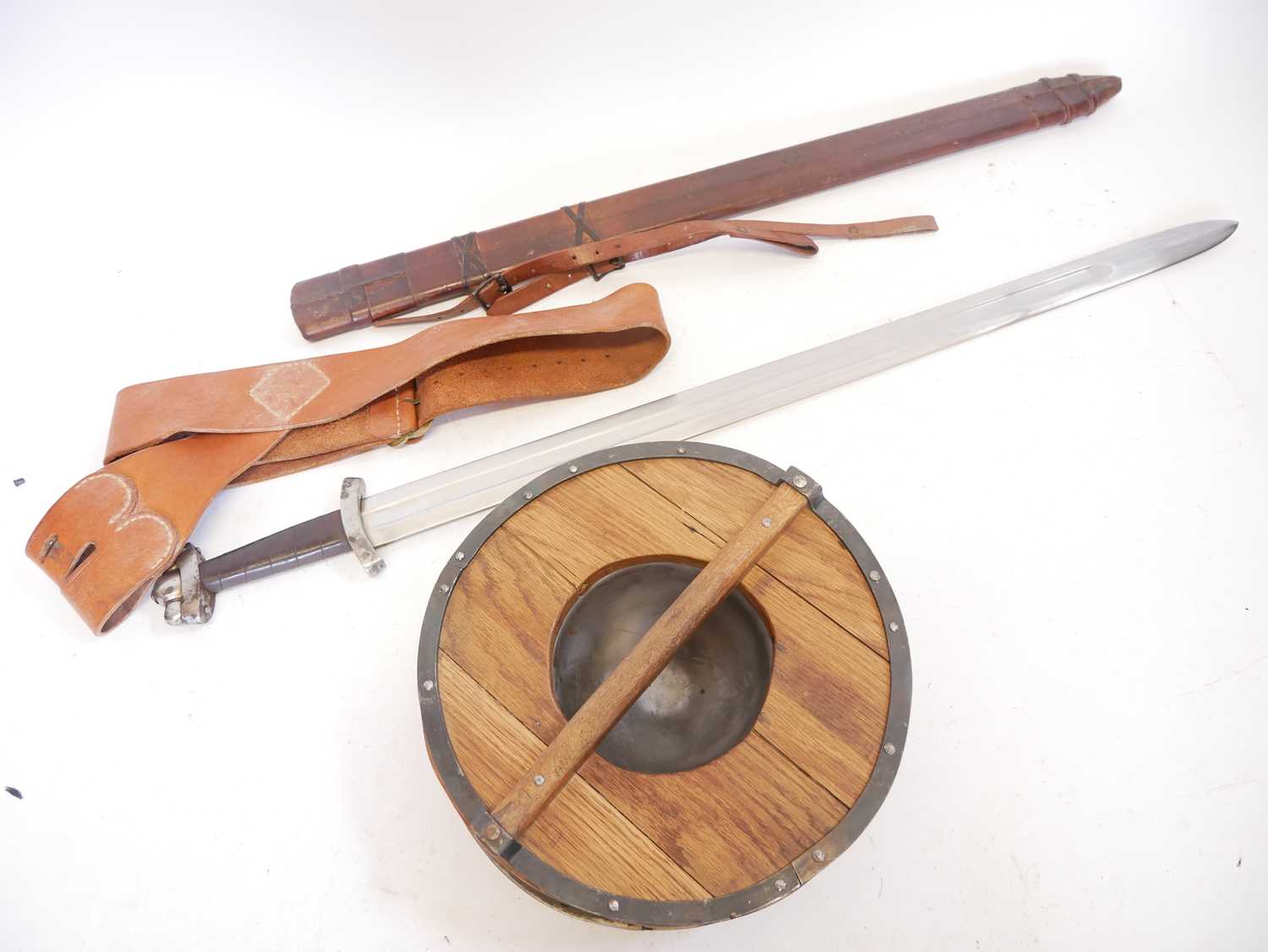Replica of a Viking broadsword, also a small wood and steel shield and ...