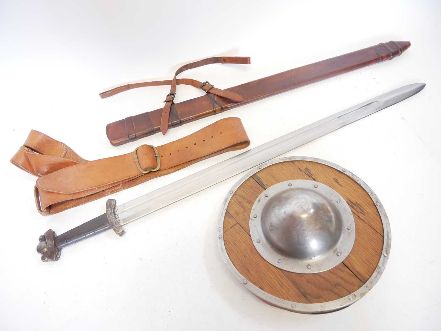 Replica of a Viking broadsword, also a small wood and steel shield and ...