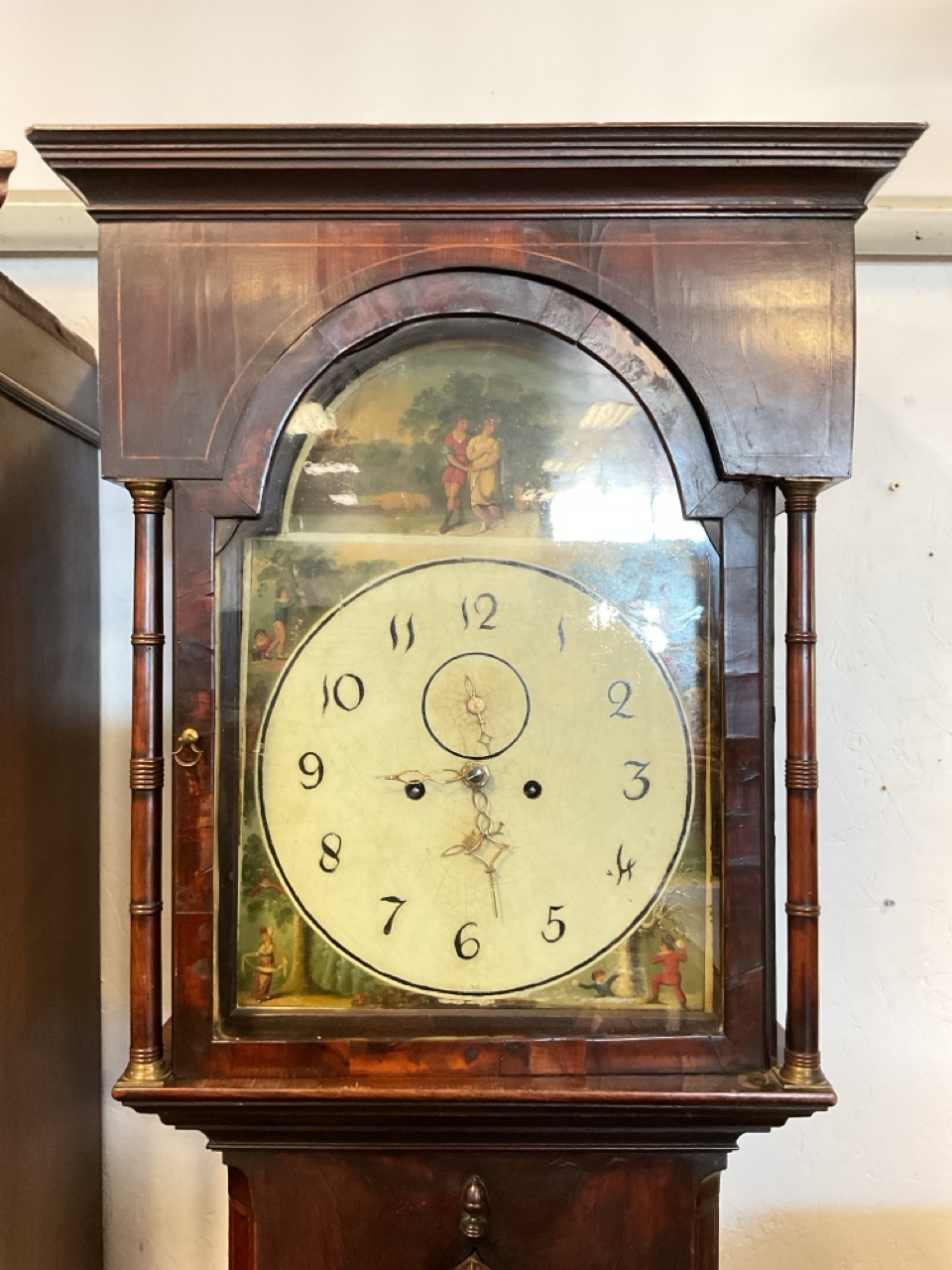 A Georgian chequer strung mahogany longcase clock with moulded cornice ...