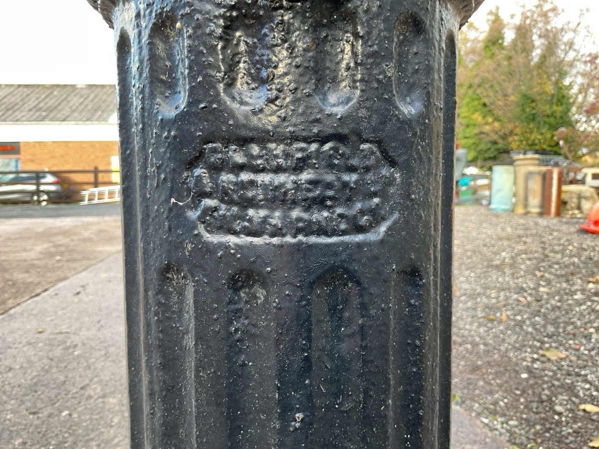 A Victorian cast iron village water pump of fluted column form with ...