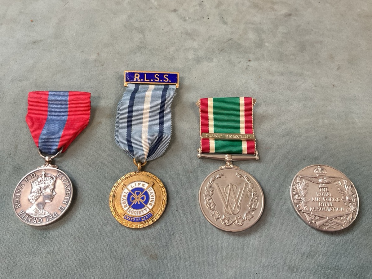 Cased Imperial Service and WVS long service medals; a cased hallmarked ...