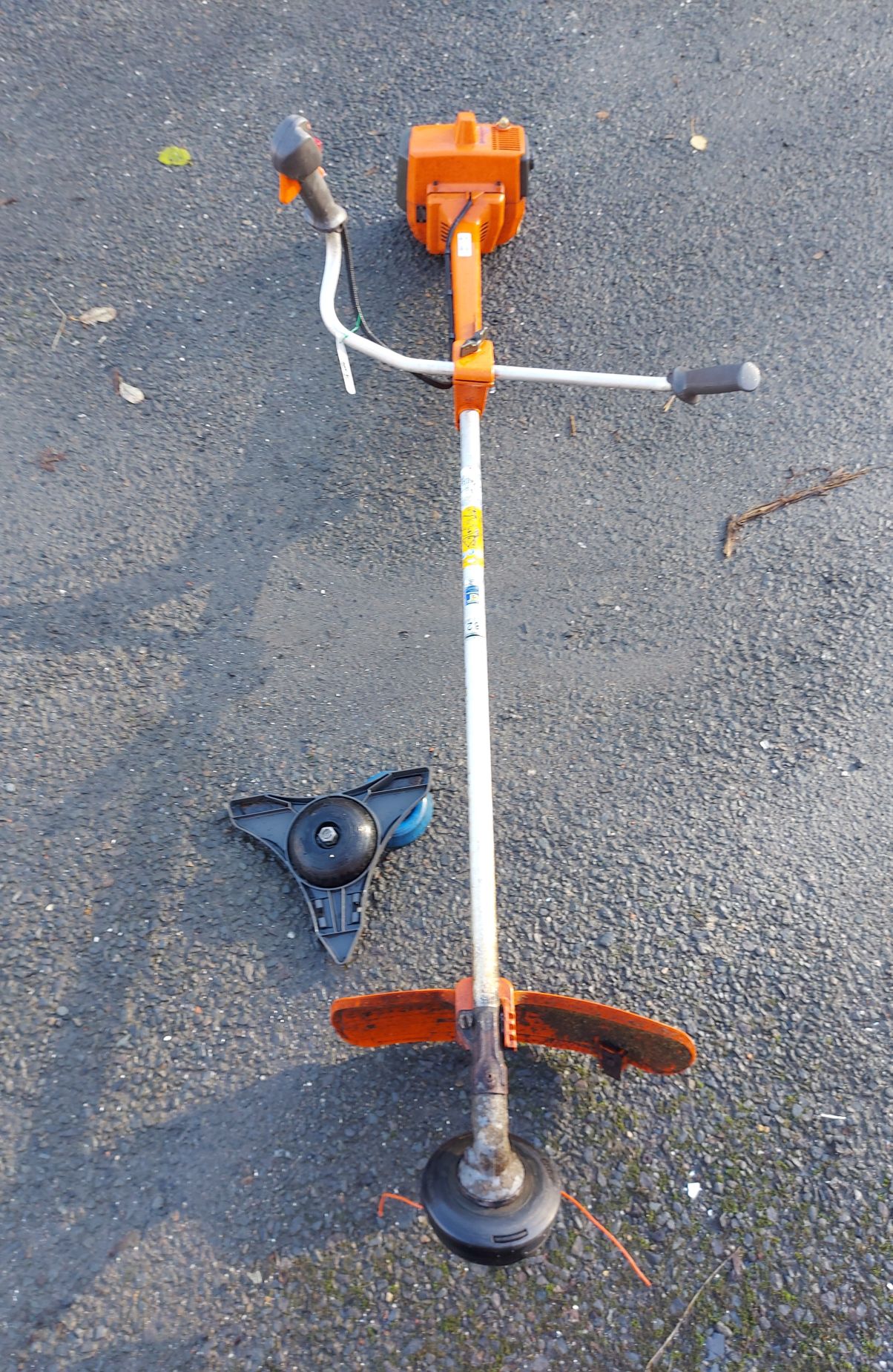 A Husqvarna 235R twin handled petrol strimmer