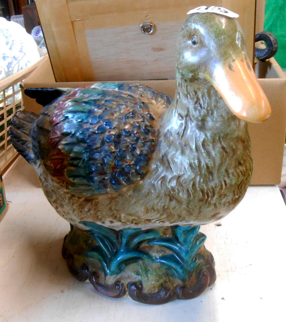 A large pottery duck figurine with colourful plumage
