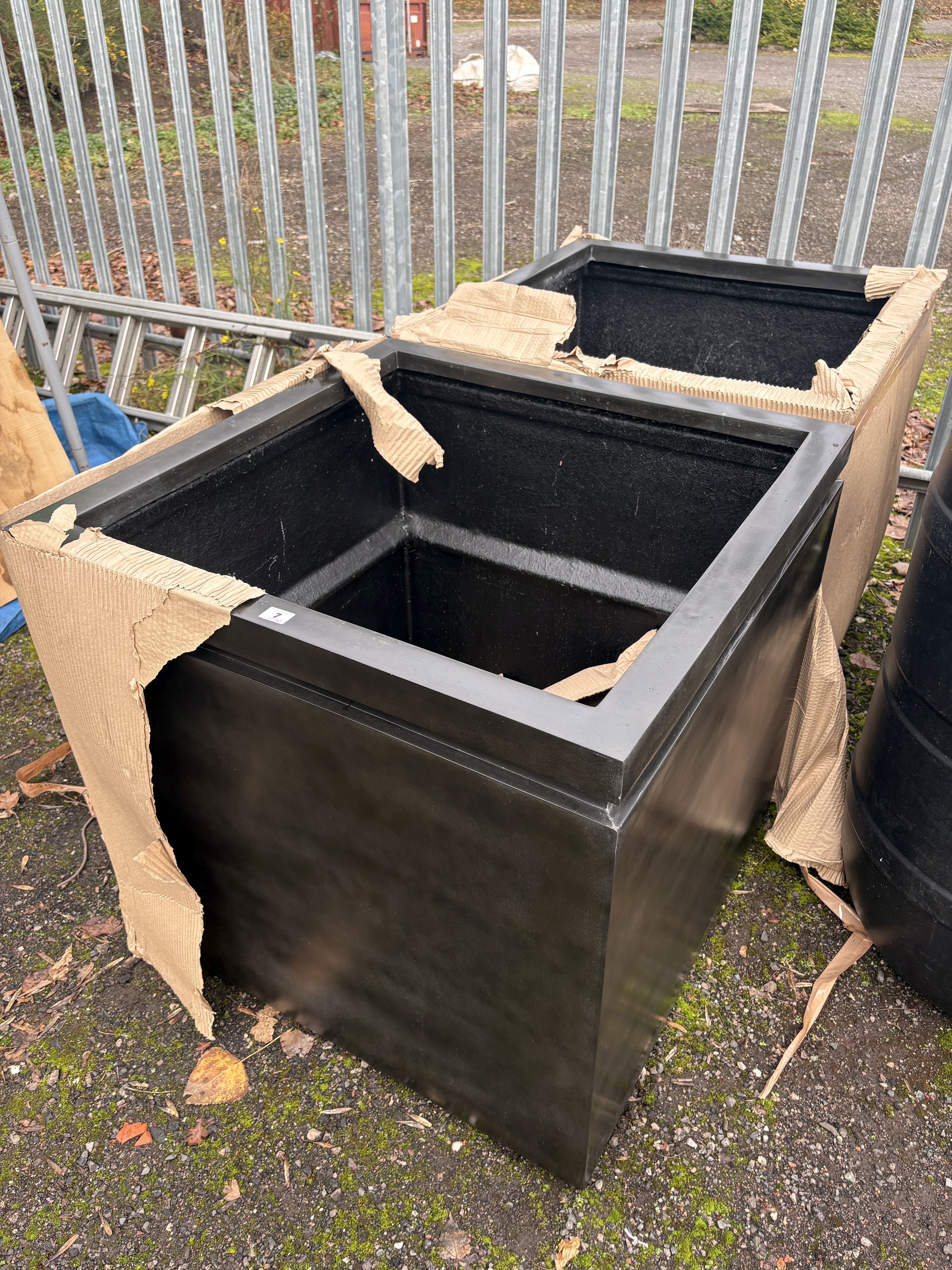 A PAIR OF LARGE BLACK FINISH FIBREGLASS PLANTER BOX, 80cm squared x ...
