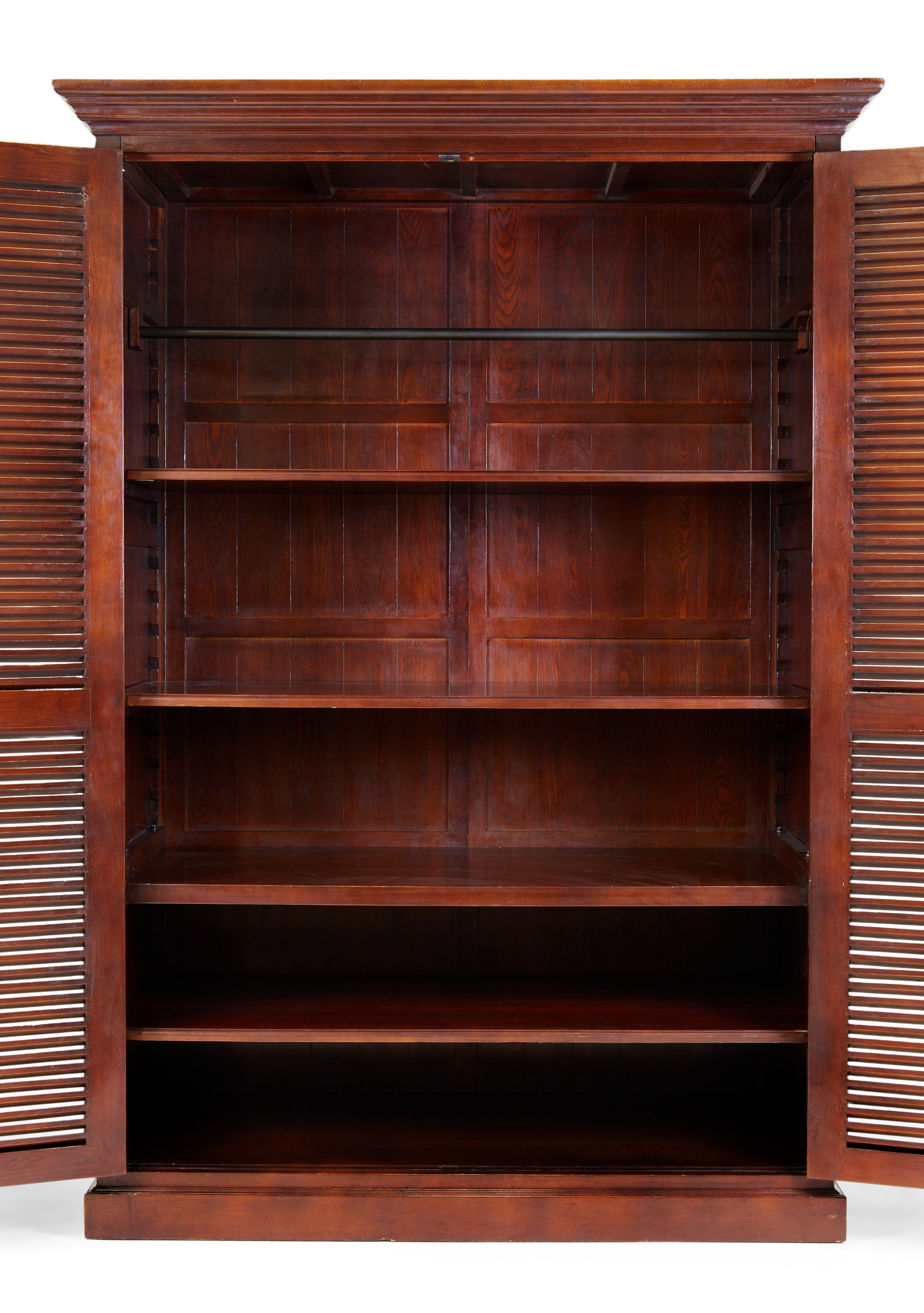 A modern lacquered oak wardrobe, with slatted doors, on plinth base ...