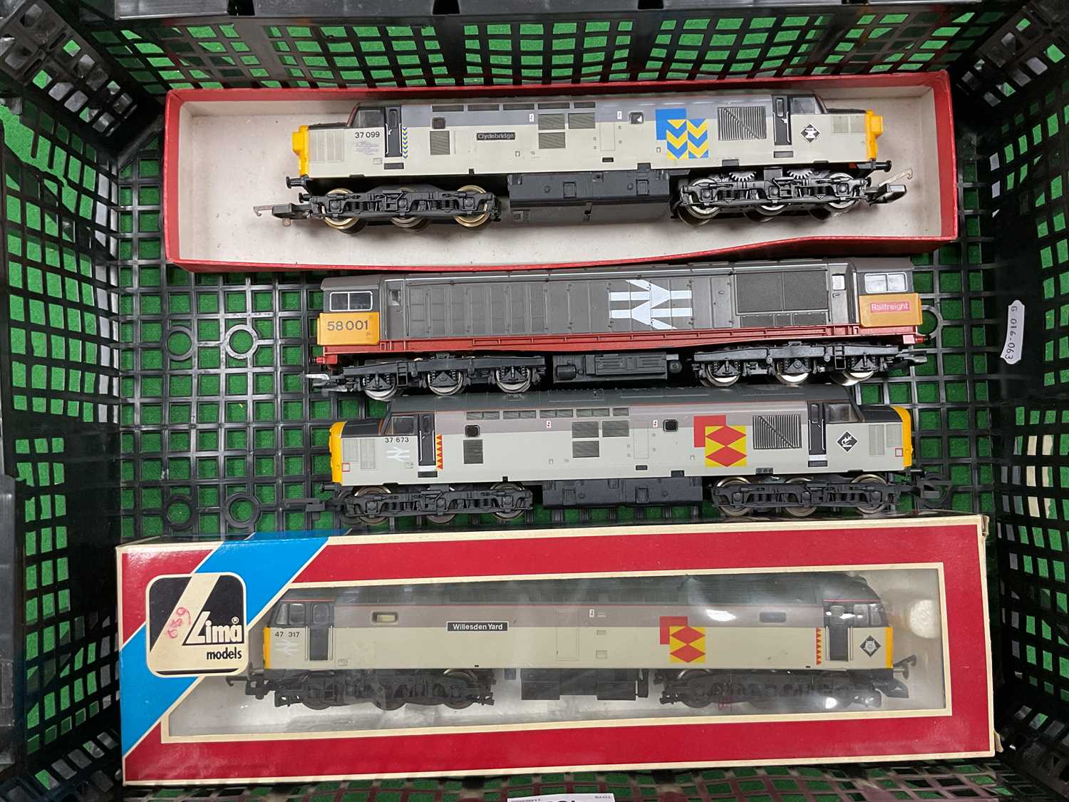 Four 00 gauge diesel locomotives in Railfreight and Sector liveries: a ...