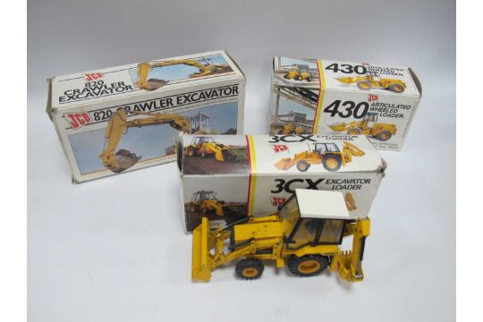 A Collection of Three Boxed NZG JCB Vehicles to Comprise: JCB 3CX ...