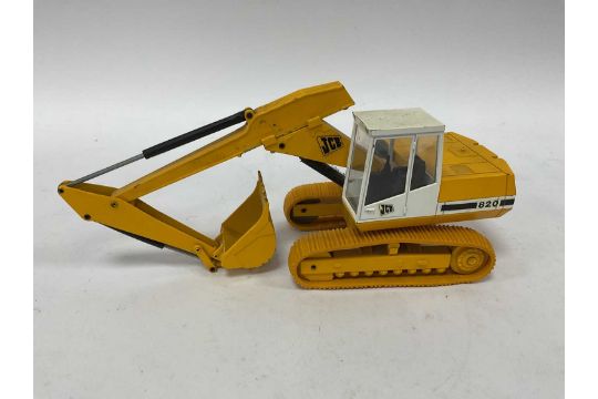 A Collection of Three Boxed NZG JCB Vehicles to Comprise: JCB 3CX ...