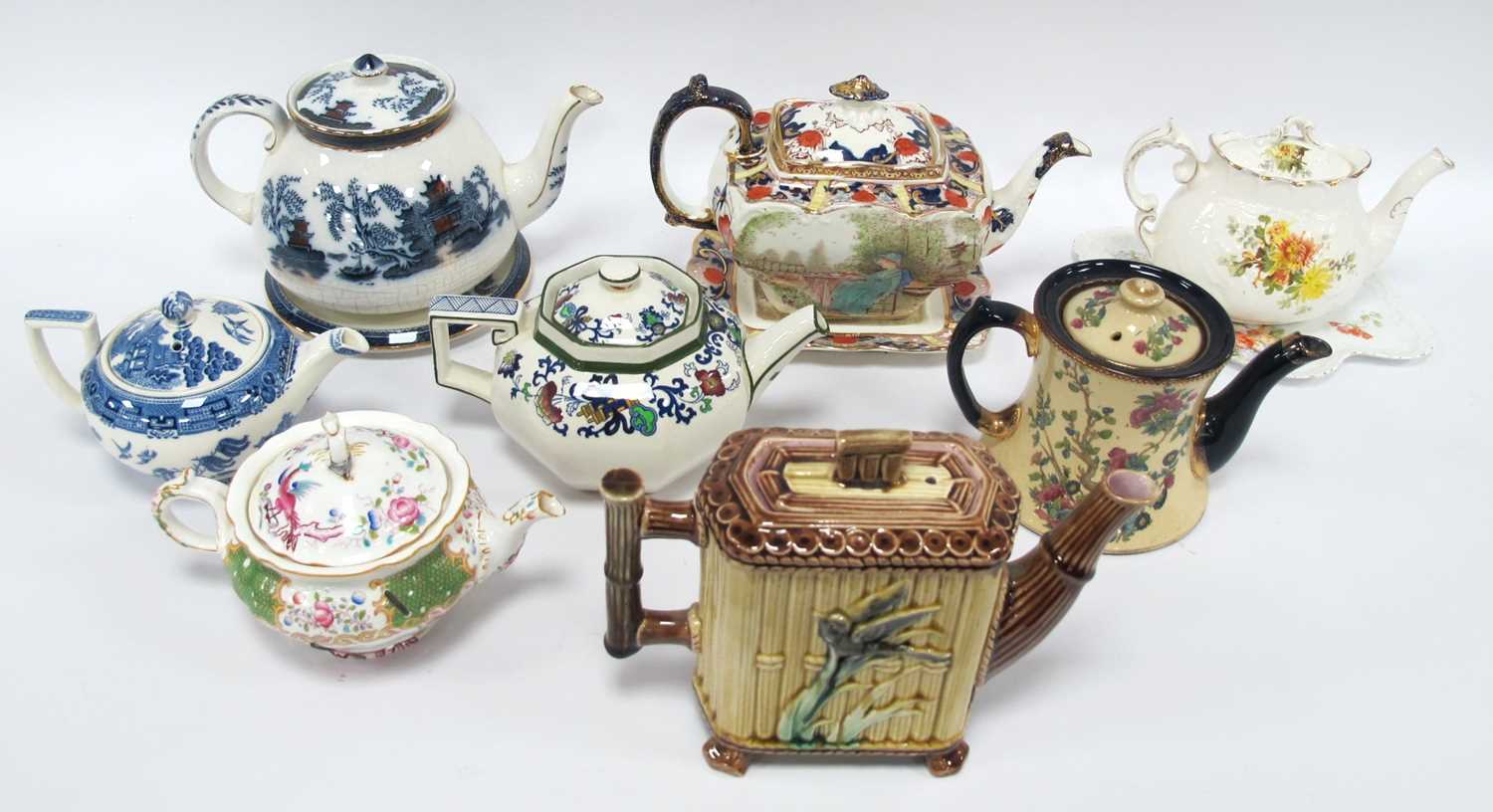 Eight antique and vintage ceramic teapots, including examples by ...