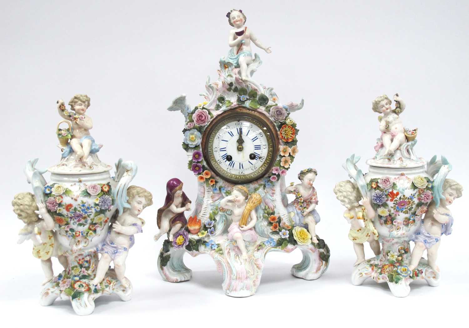A Late XIX Century German Porcelain Clock Garniture, the clock ...