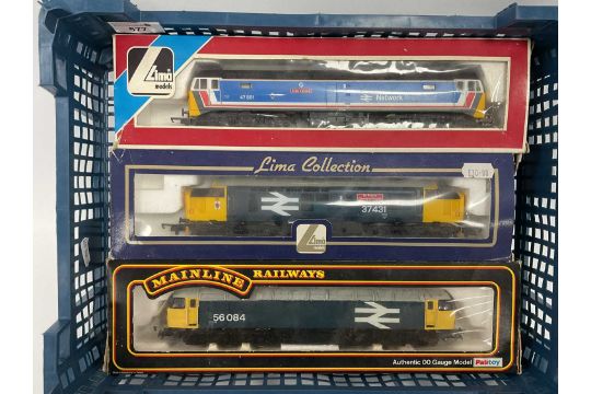 Three boxed 00 gauge diesel locomotives: a Mainline Class 56 "56084" in ...