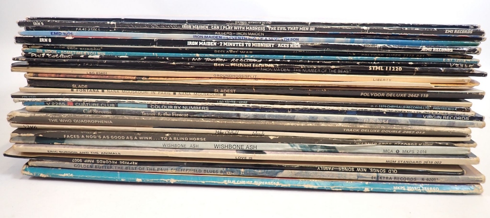 A collection of heavy rock vinyl records including many Iron Maiden etc.