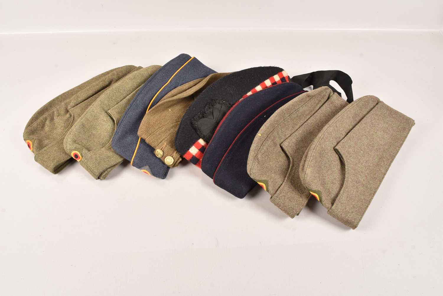 A collection of Side Caps, including a 1940sCollett Limited British ...