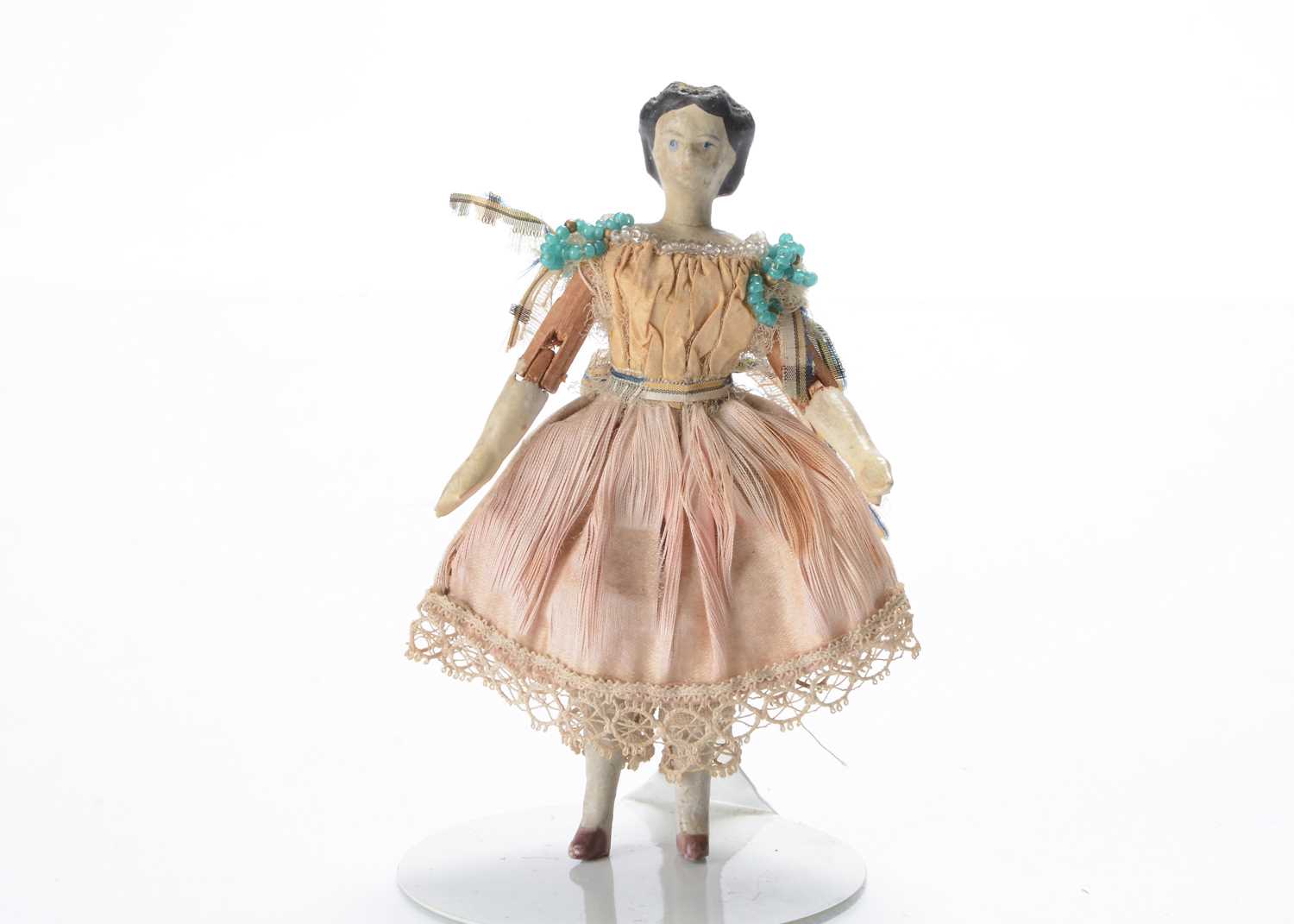 An 19th century German ‘alien head’ composition dolls’ house doll with ...