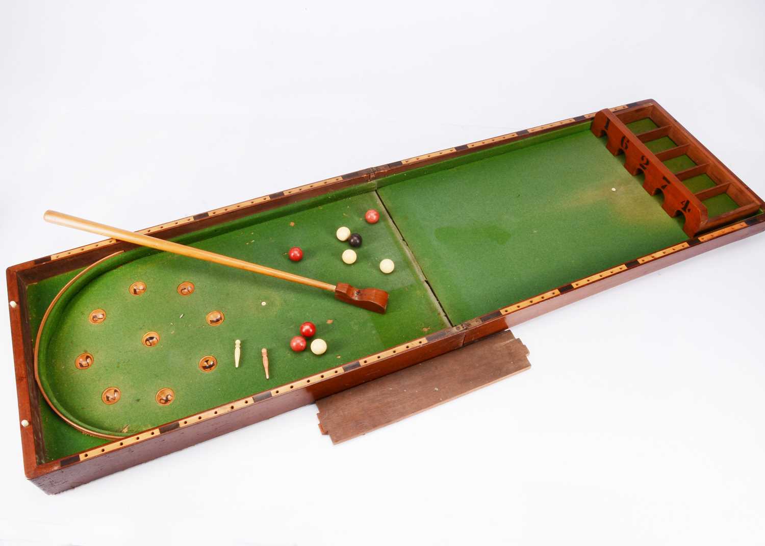 An 19th century table top folding Bagatelle game, mahogany case opening ...