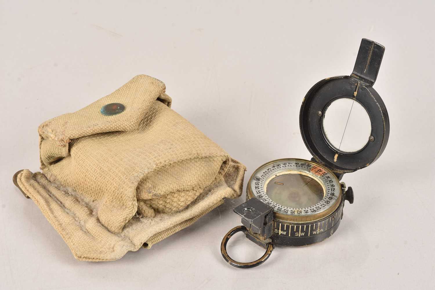A WWII Military Issue Pocket Compass, by T.G.Co Ltd, dated 1940, No ...